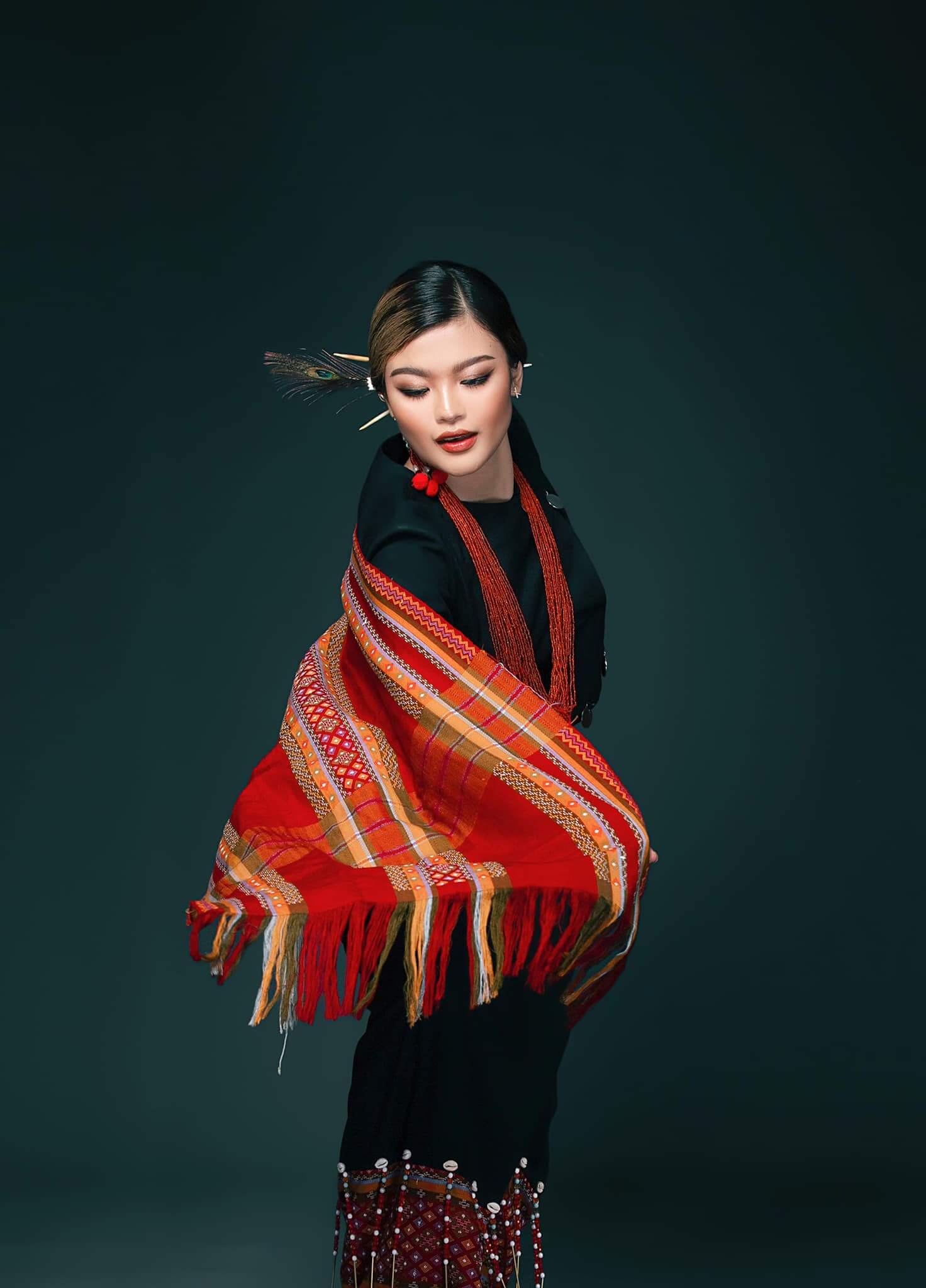 Attractive Chin model, Margaret, demonstrates the traditional dance ...