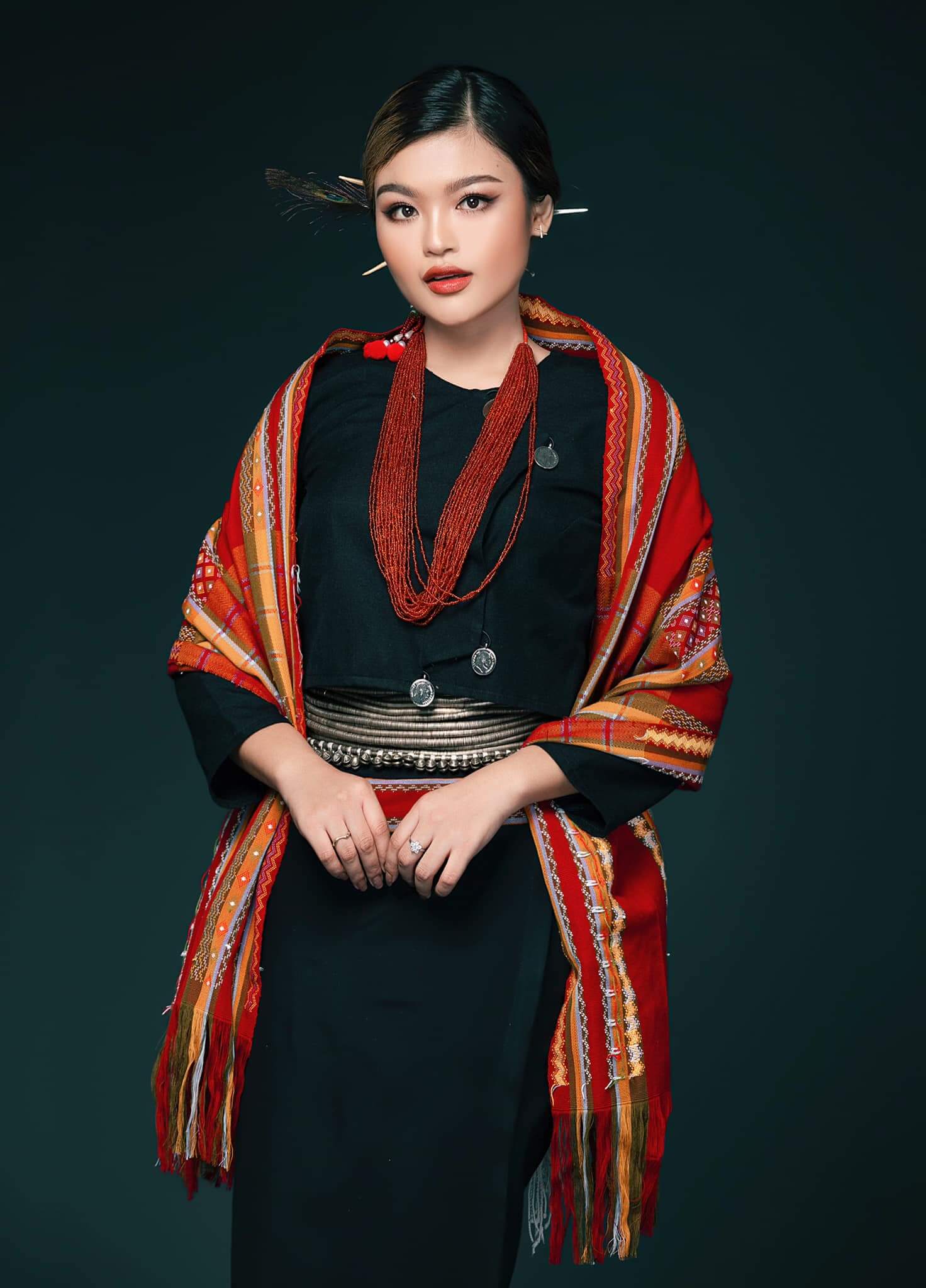 Attractive Chin model, Margaret, demonstrates the traditional dance ...