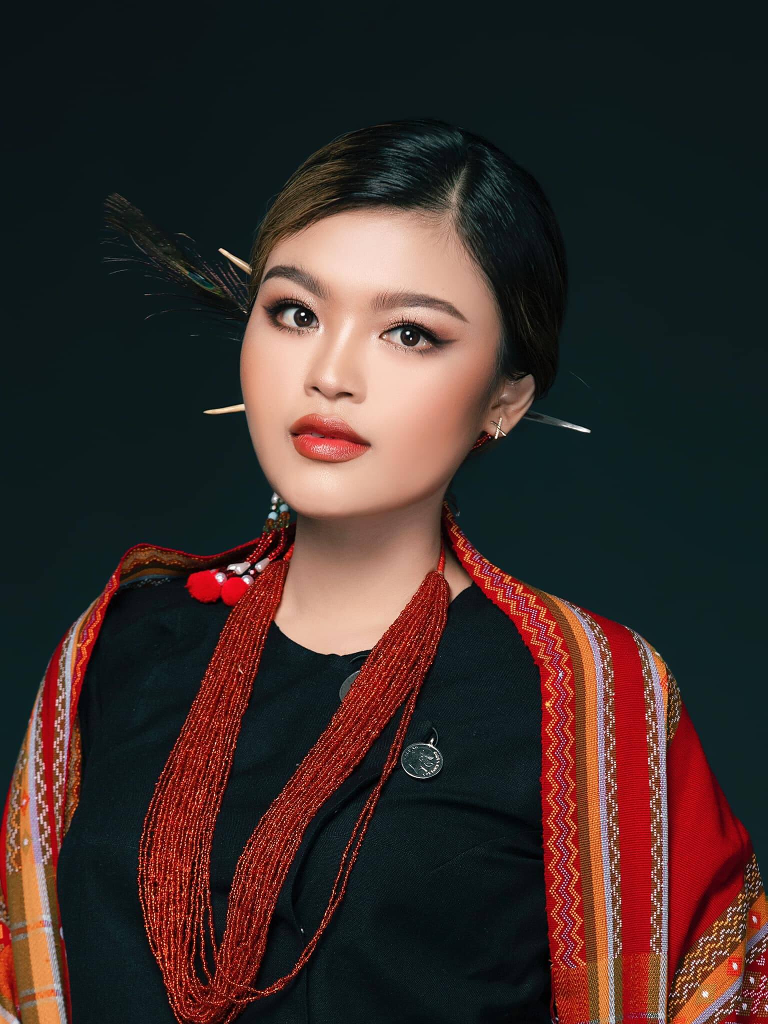Attractive Chin model, Margaret, demonstrates the traditional dance ...