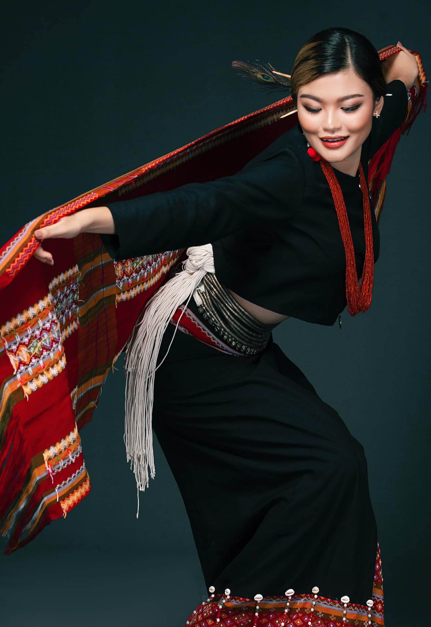 Attractive Chin model, Margaret, demonstrates the traditional dance ...